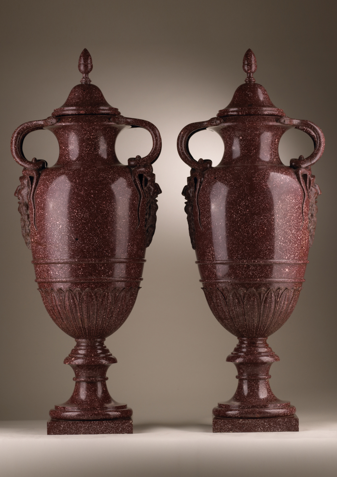 Roman | Important pair of large carved Egyptian Porphyry vases and covers